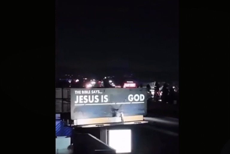 Man Defies Apostate Billboard, Paints Over Message to Declare: 'Jesus ...