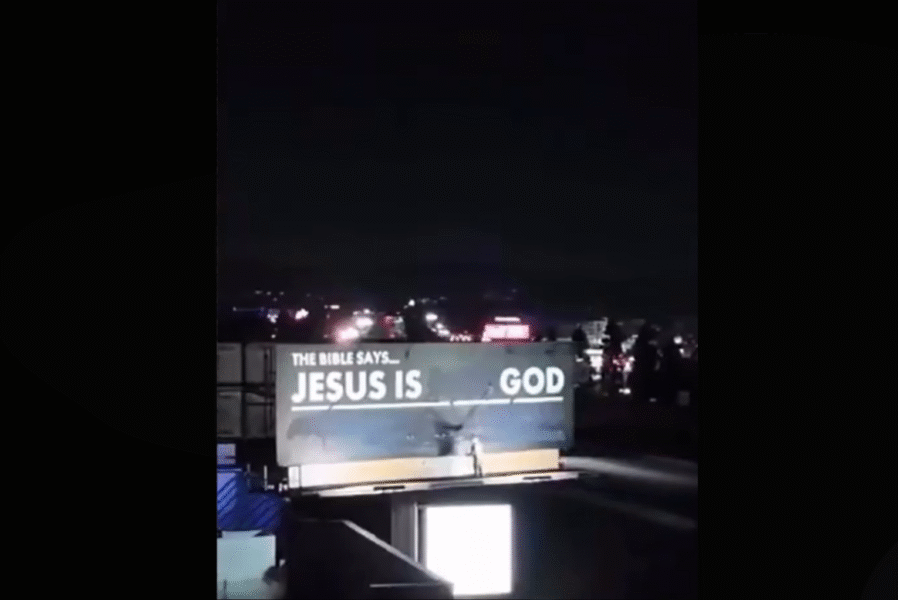 Man Defies Apostate Billboard, Paints Over Message to Declare: 'Jesus ...